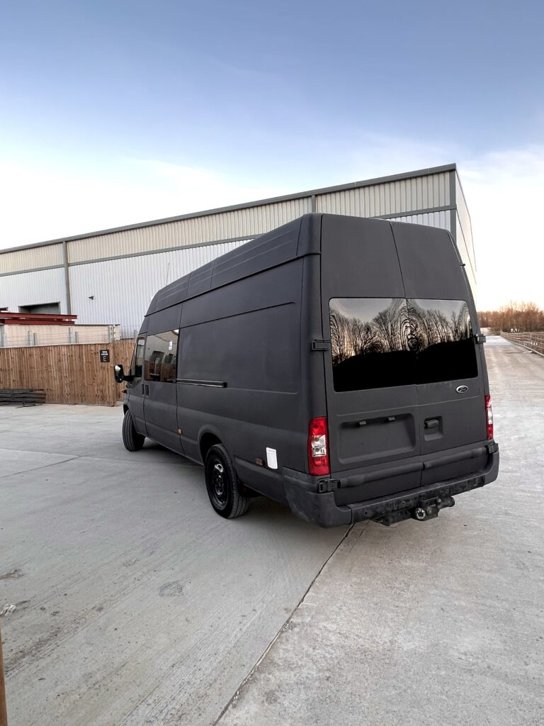 STEALTH FORD TRANSIT WITH LARGE ELEVATING BED | Quirky Campers